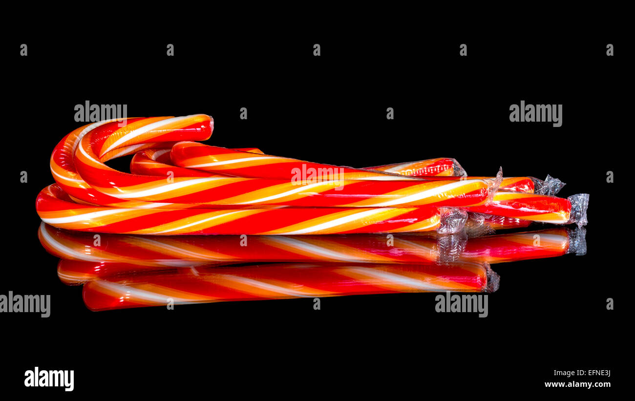 Colorful candy canes thrown into a pile Stock Photo - Alamy
