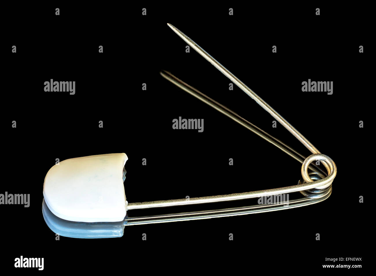 Opened safety pin with a white plastic tip Stock Photo - Alamy