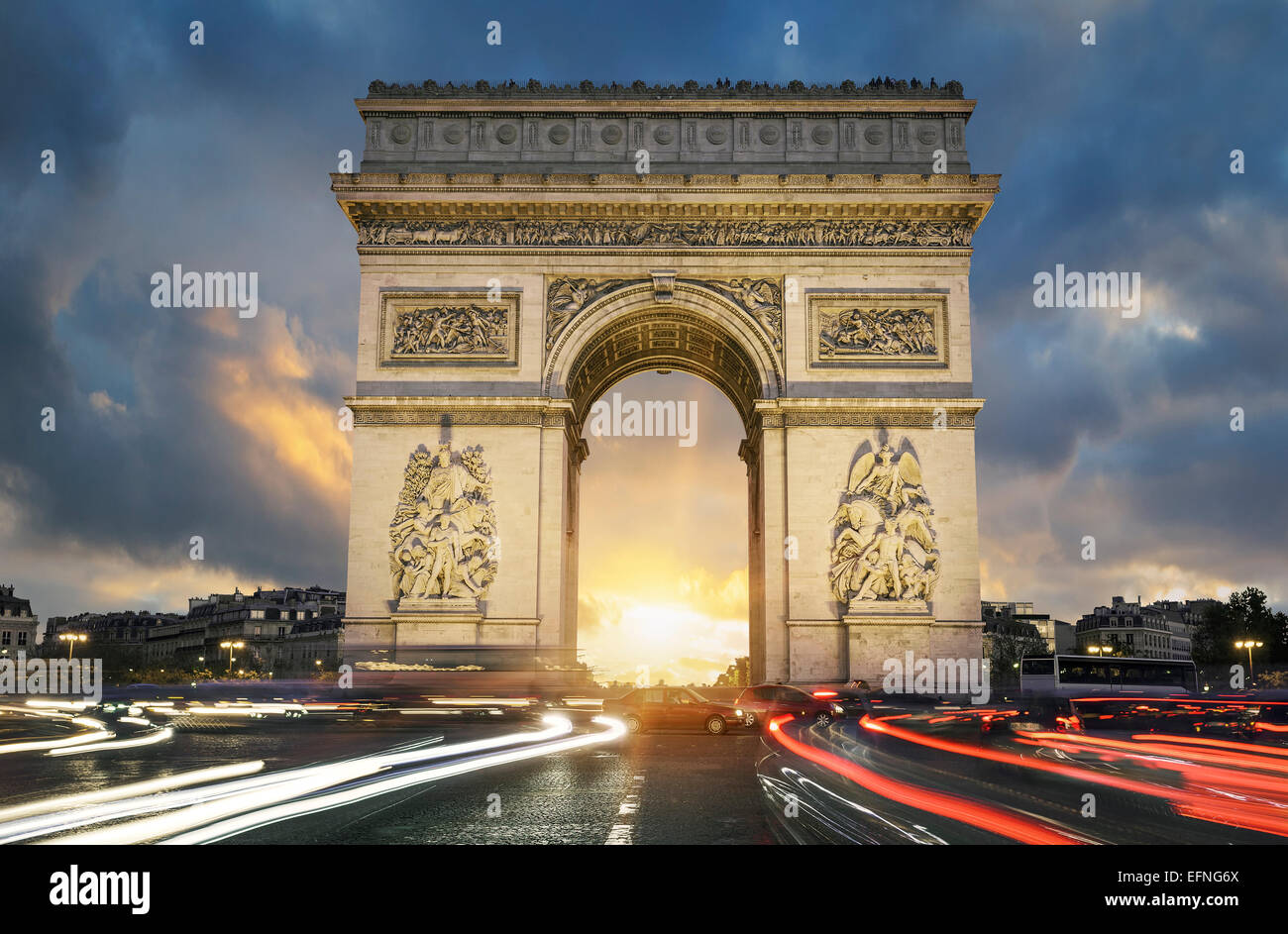 View of famous Arc de Triomphe at sunset, Paris Stock Photo - Alamy
