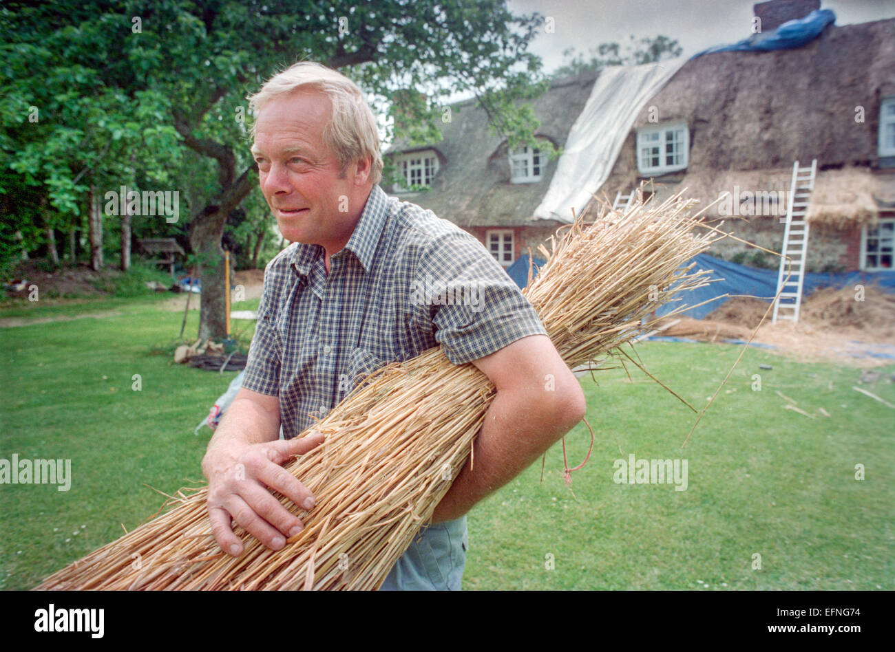 Thatcher Stephen Cleeve builds a traditional roof on a cottage in ...