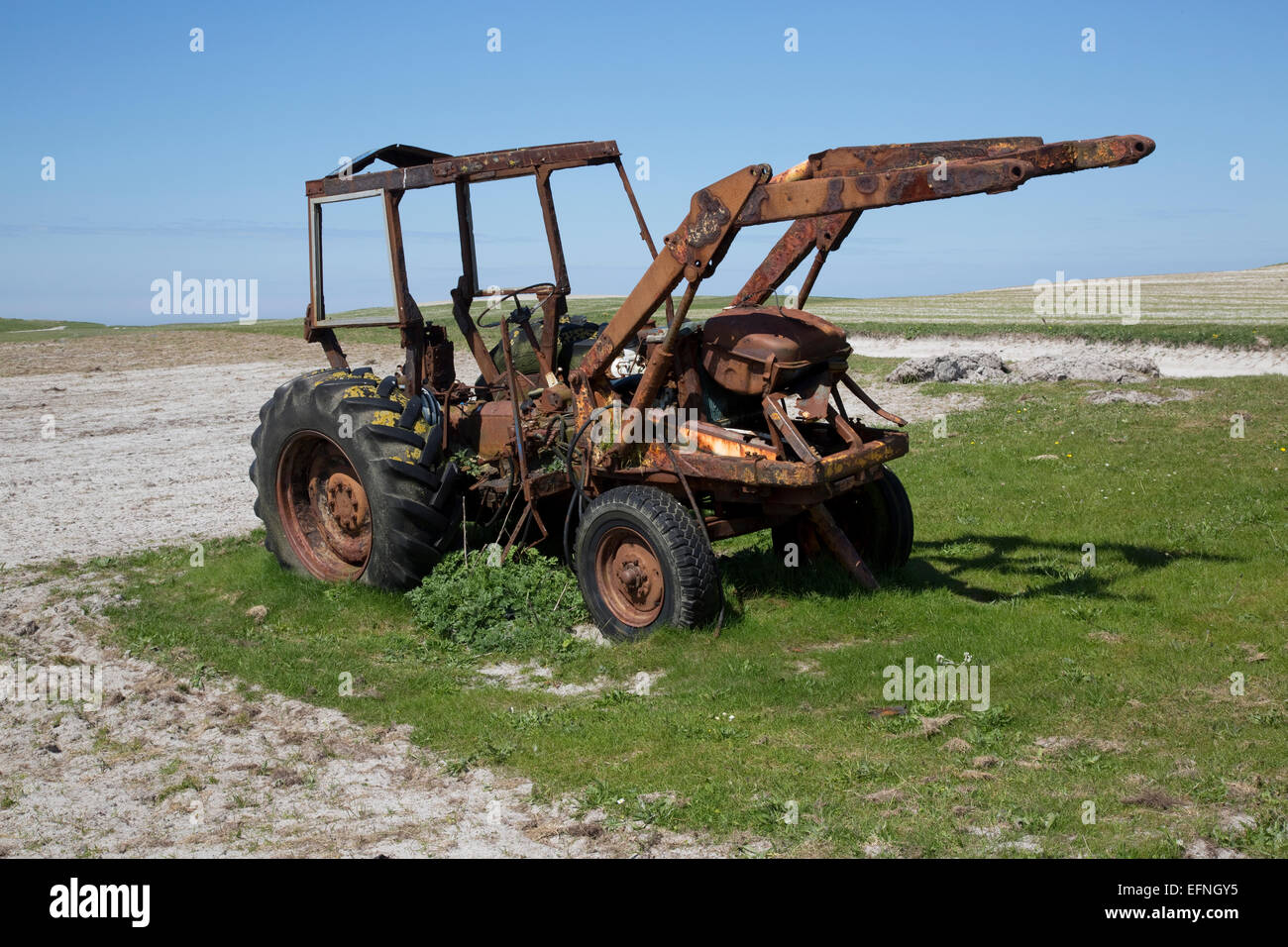 Rusty old tractor in machair Balranald Nature Reserve North Uist Outer ...