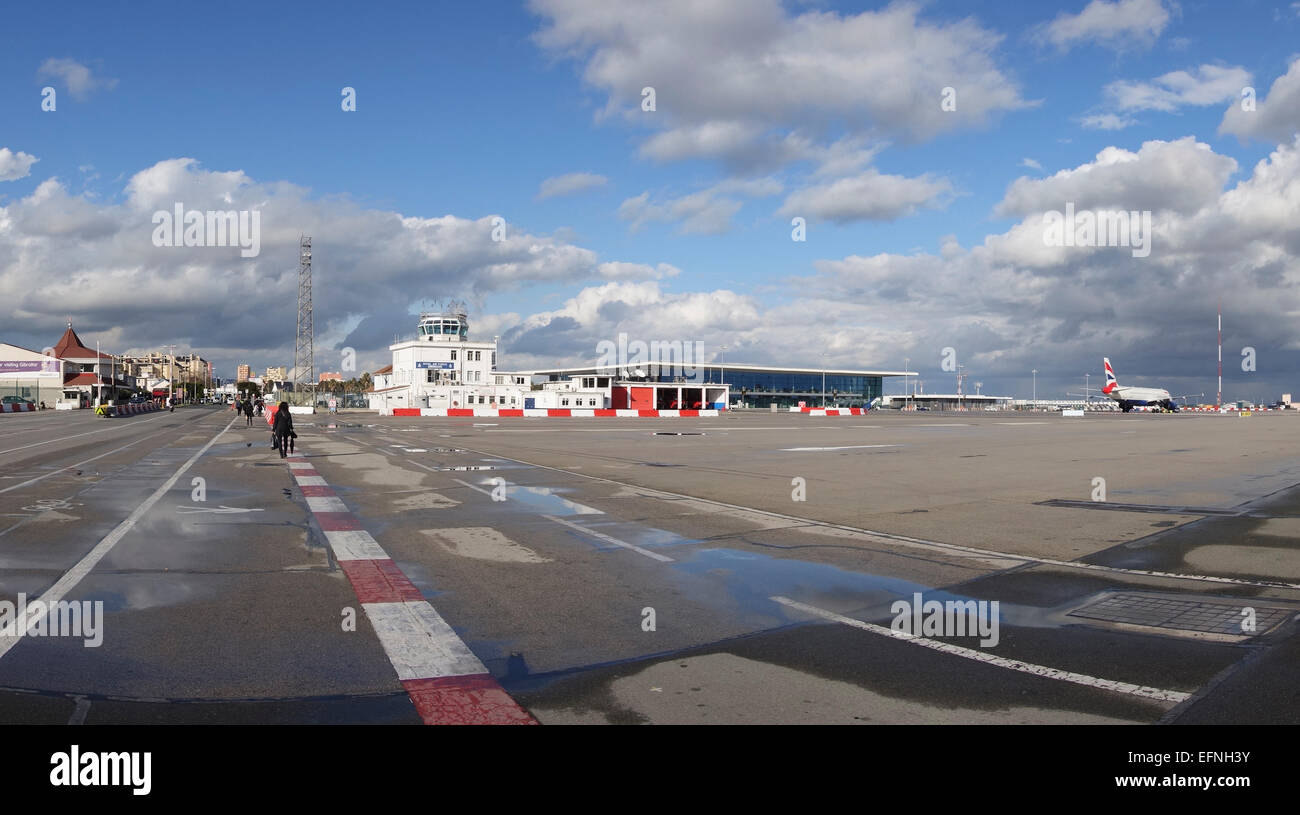 Gibraltar rock. Cars and pedestrians cross the runway of Gibraltar ...