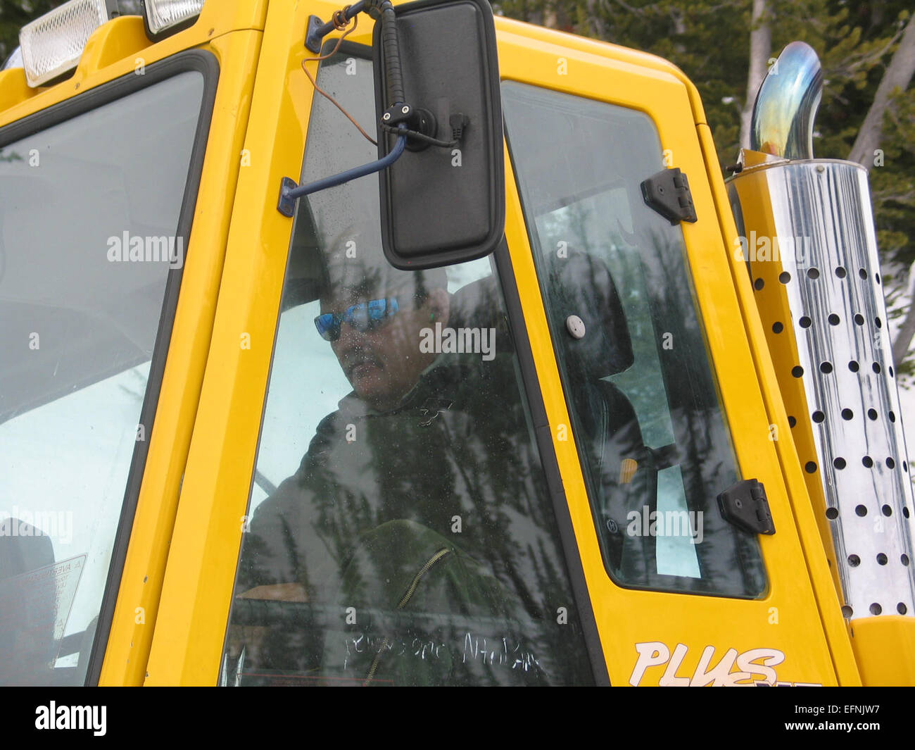 Bud Hoeme operating a snow groomer during spring plowing in Yellowstone ...