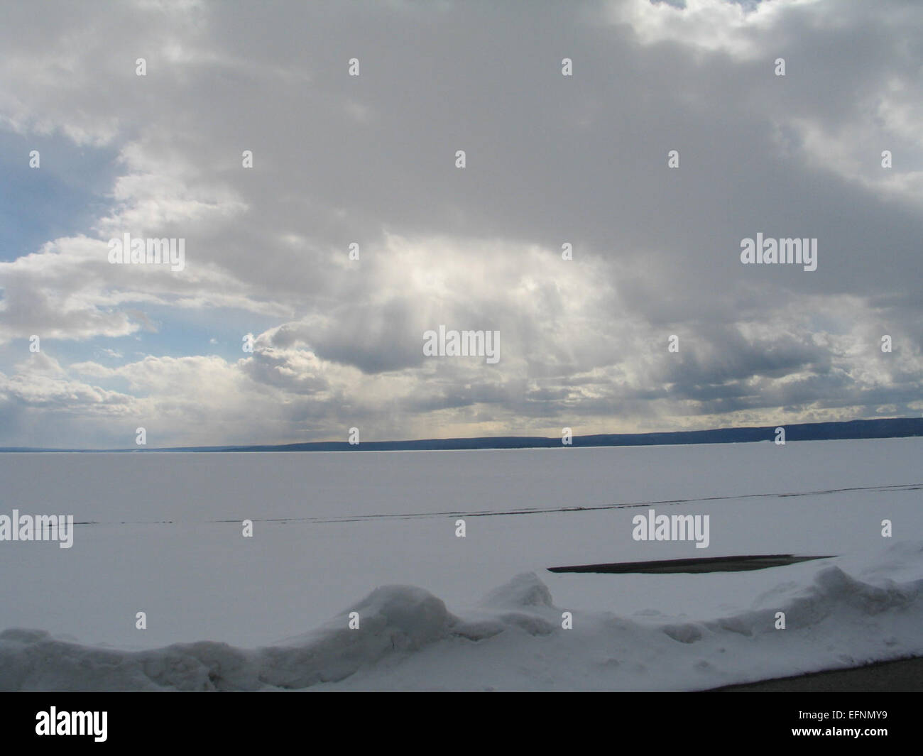 A scenic view across a lake during spring plowing, captured by Davey ...