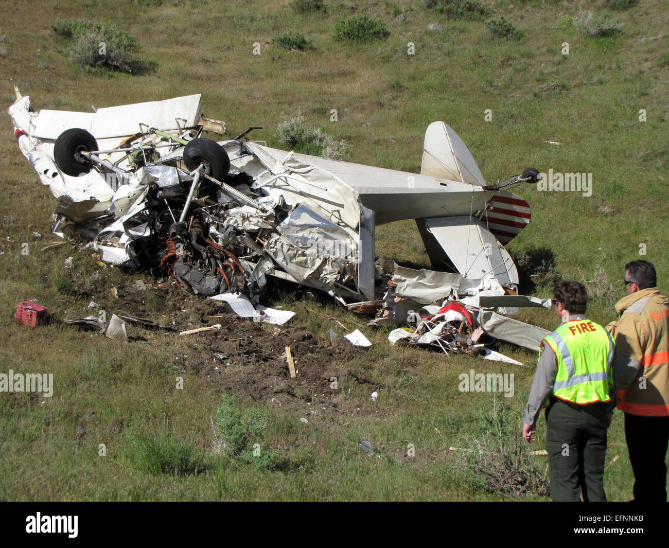 This image depicts the aftermath of a plane crash, capturing the ...