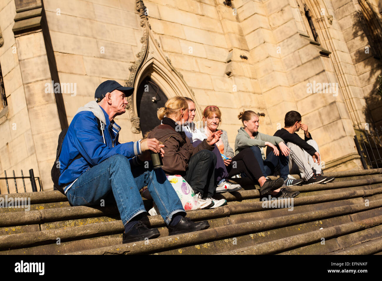People sitting on a stairs discussing talking watching resting Stock ...