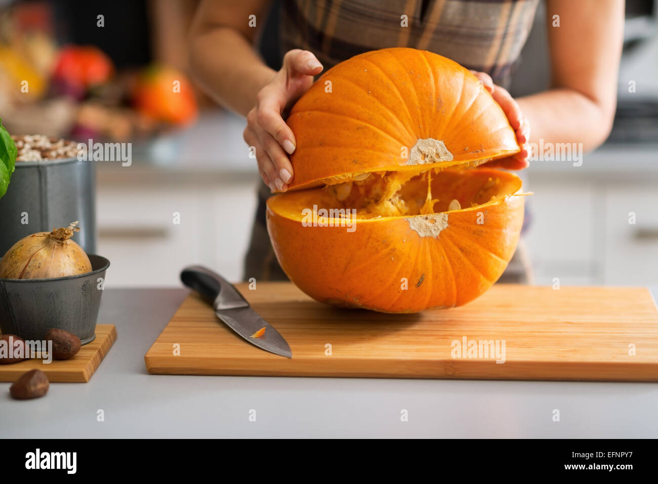 Woman cutting pumpkin on hi-res stock photography and images - Alamy