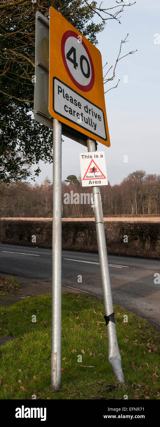 Road sign please drive carefully damaged by car Stock Photo - Alamy