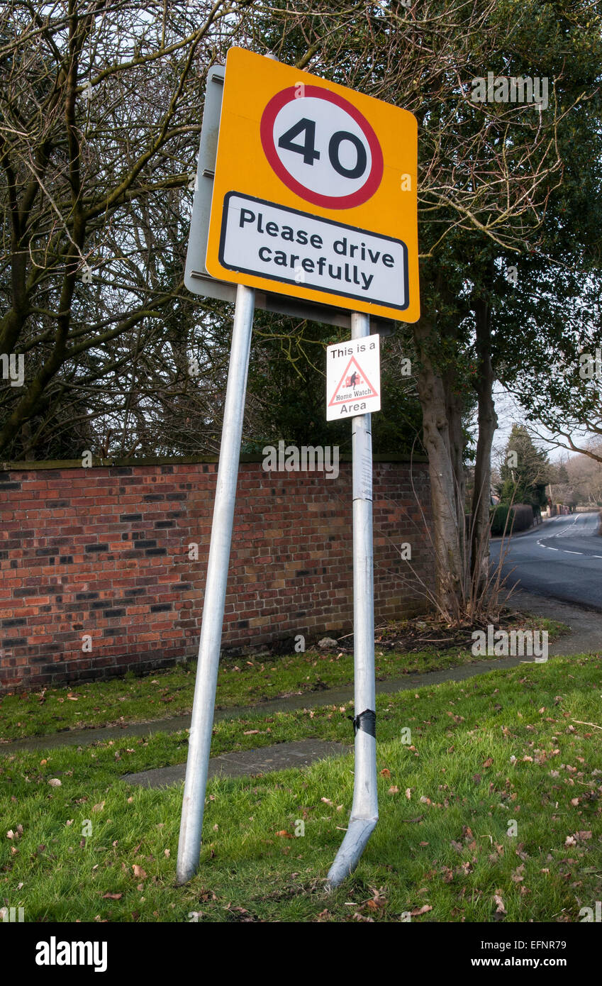 Road sign please drive carefully damaged by car Stock Photo - Alamy