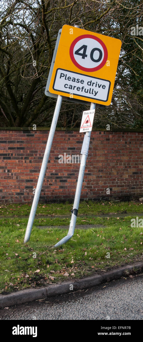 Road sign please drive carefully damaged by car Stock Photo - Alamy