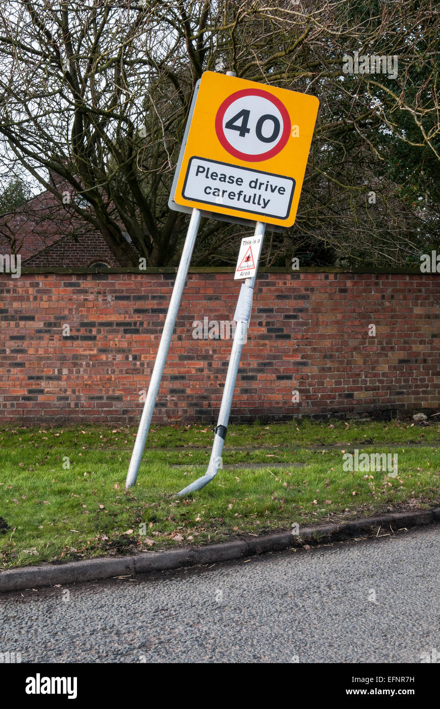 Road sign please drive carefully damaged by car Stock Photo - Alamy
