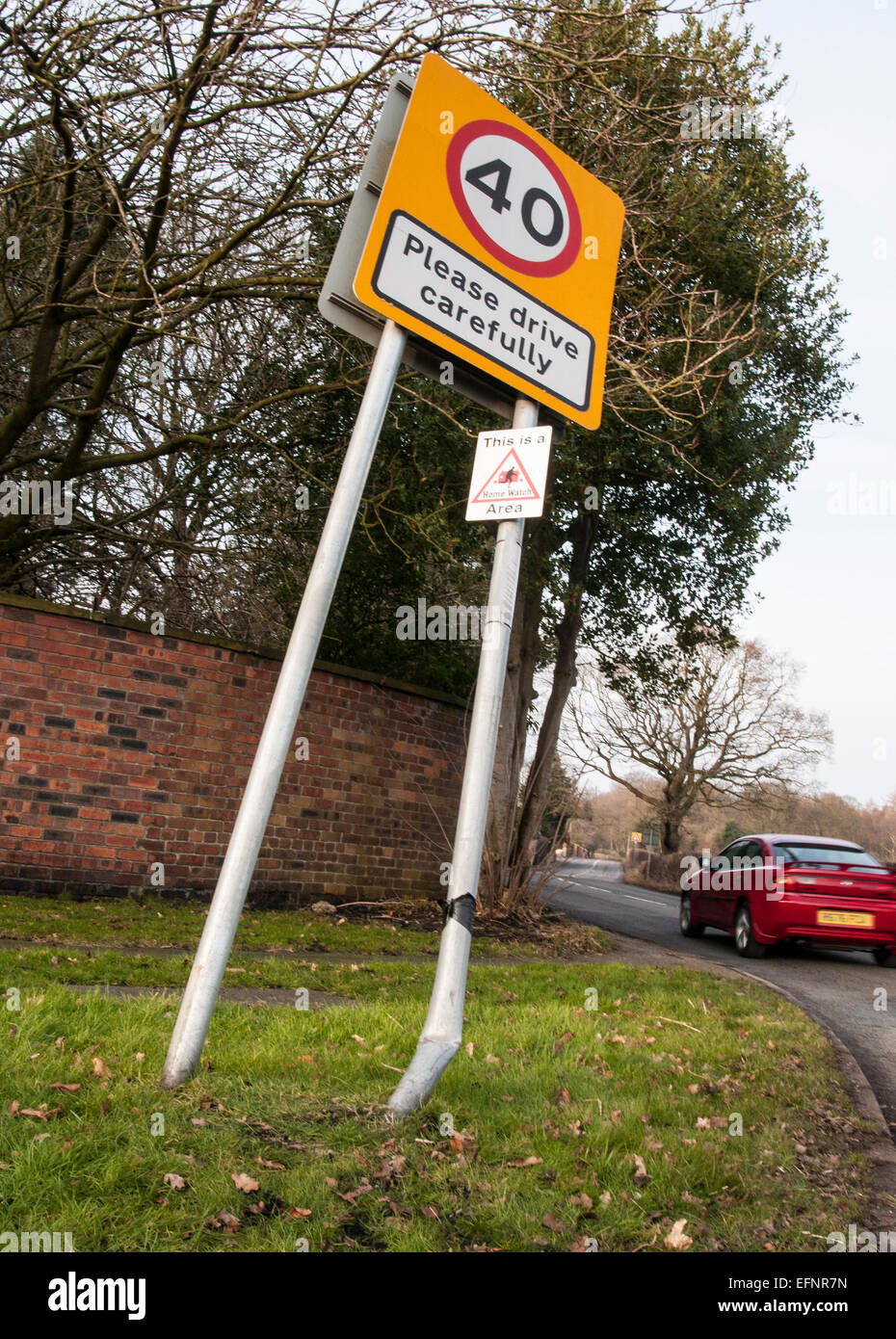 Road sign please drive carefully damaged by car Stock Photo - Alamy