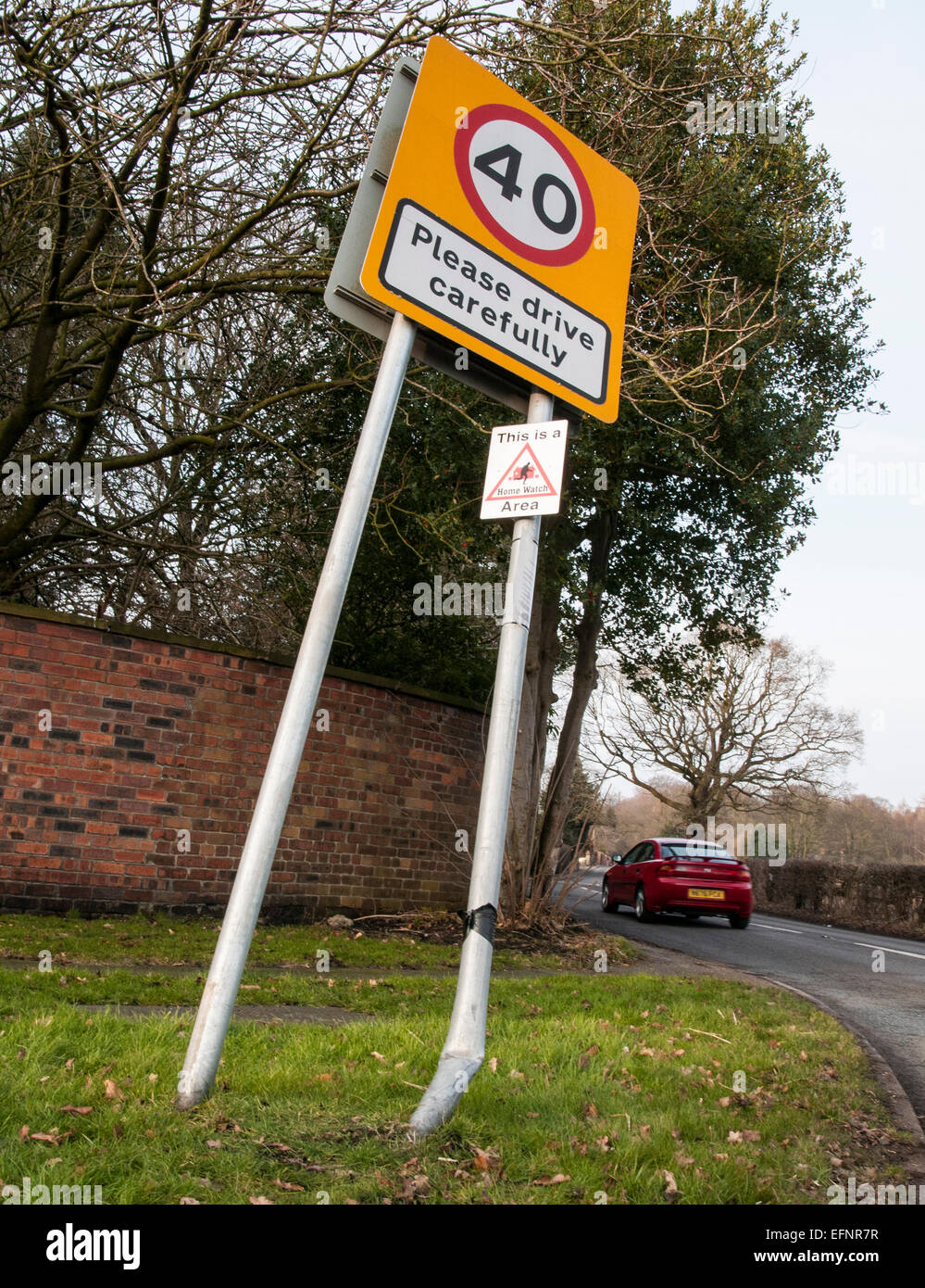 Road sign please drive carefully damaged by car Stock Photo - Alamy