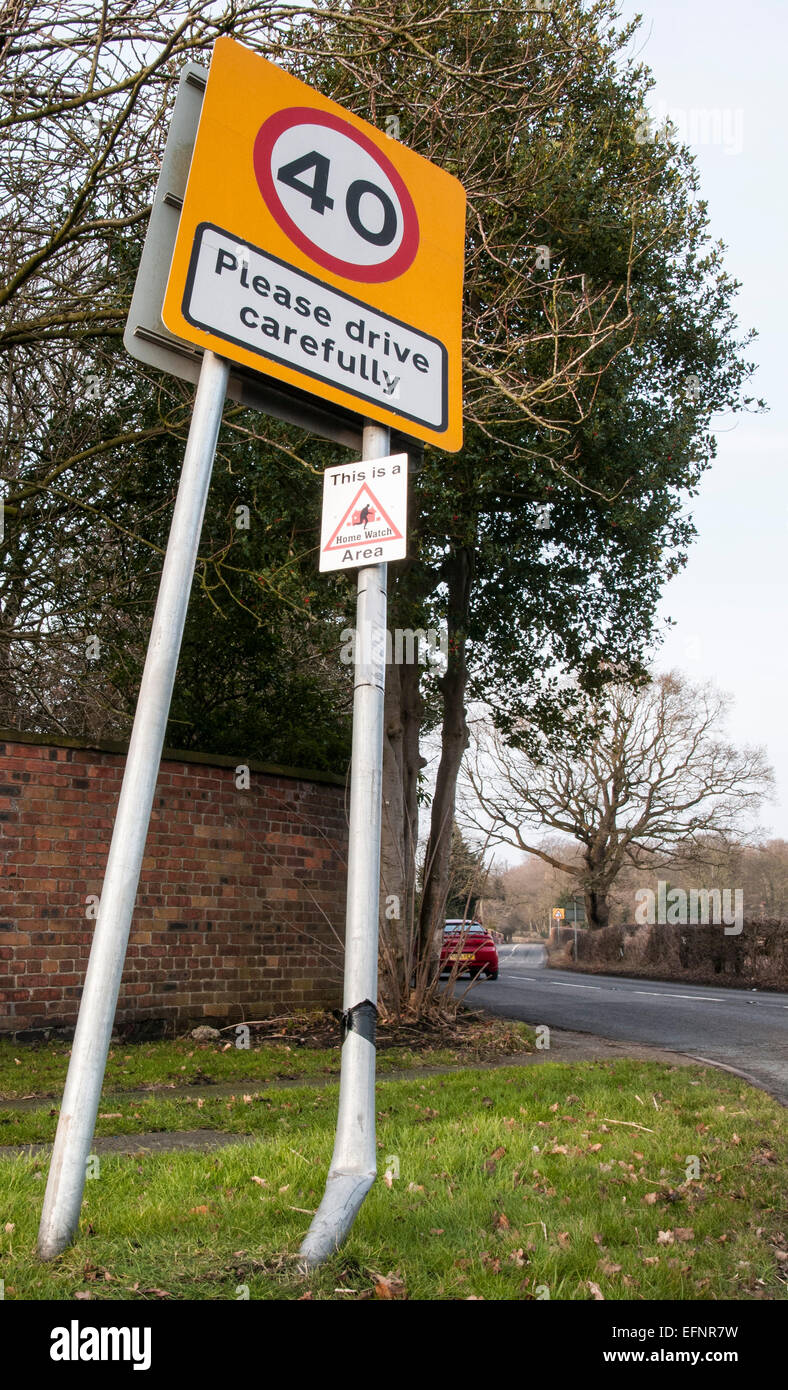 Road sign please drive carefully damaged by car Stock Photo - Alamy