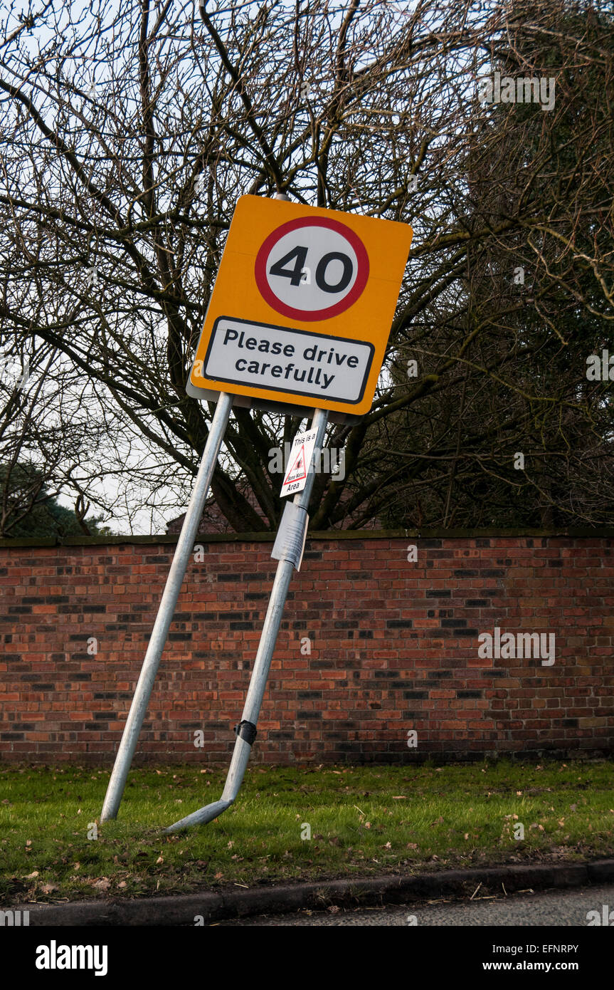 Road sign please drive carefully damaged by car Stock Photo - Alamy