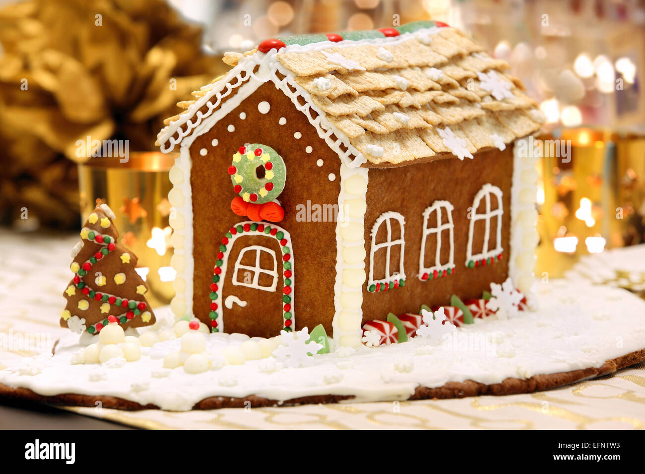 Christmas gingerbread house on the decorated table Stock Photo - Alamy