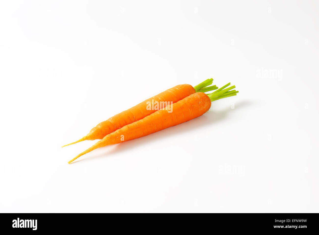 Raw fresh carrot on white background Stock Photo - Alamy