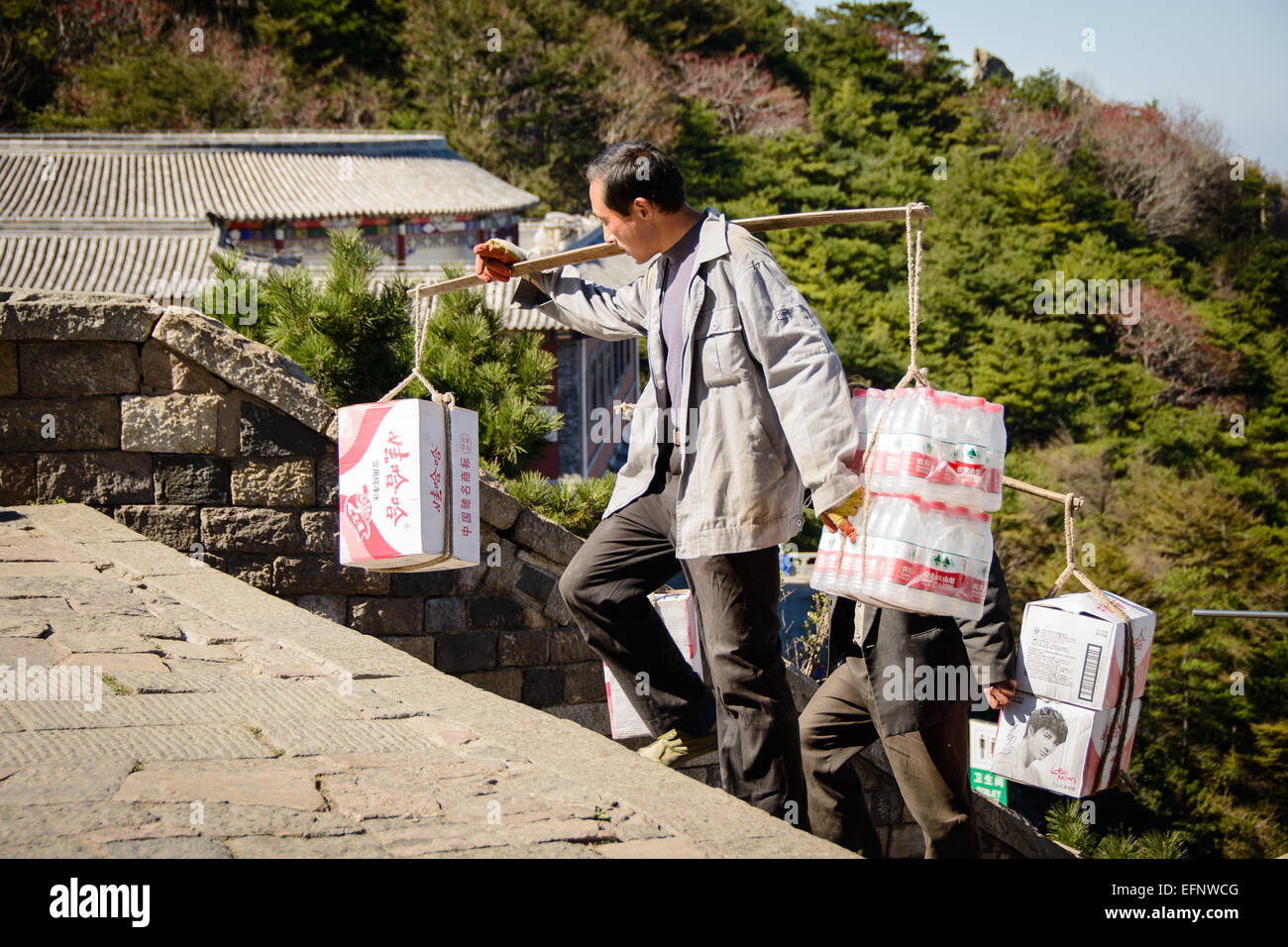 Manual workers carrying heavy loads at Tai Shan Mountain, China Stock ...
