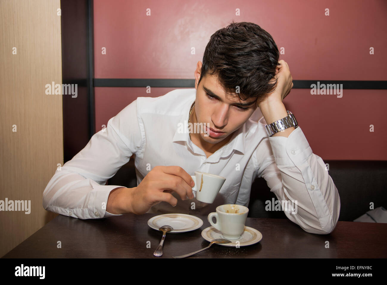 Sad man holding cup coffee hi-res stock photography and images - Alamy
