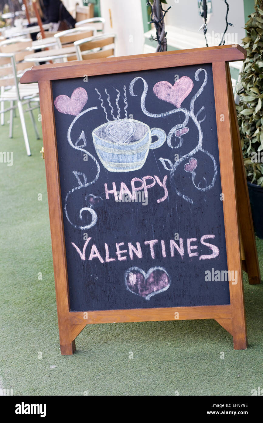 Blackboard with Happy Valentines day written in pink chalk Stock Photo ...