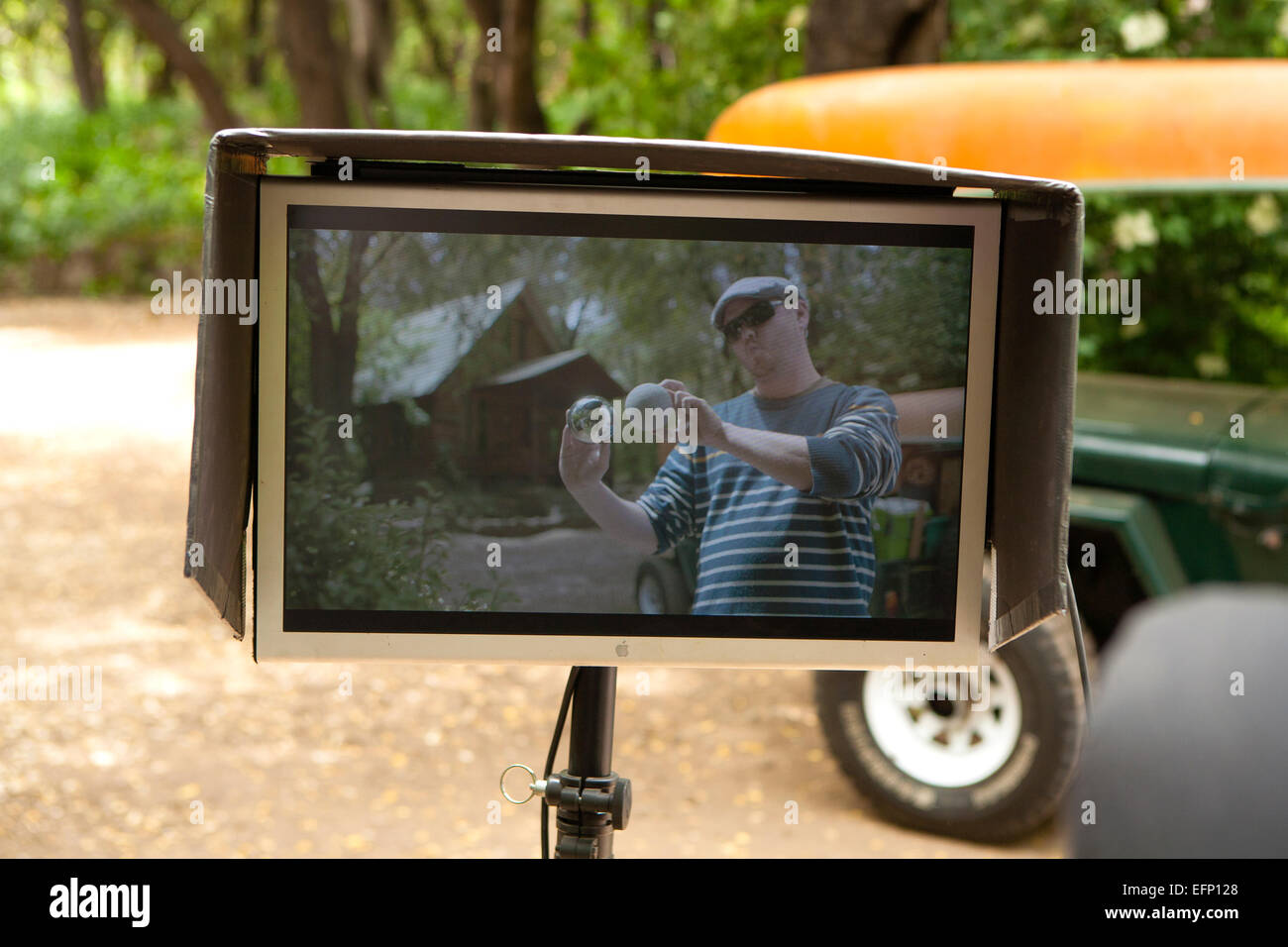 VFX Supervisor holding light-reflective balls to camera for reference ...