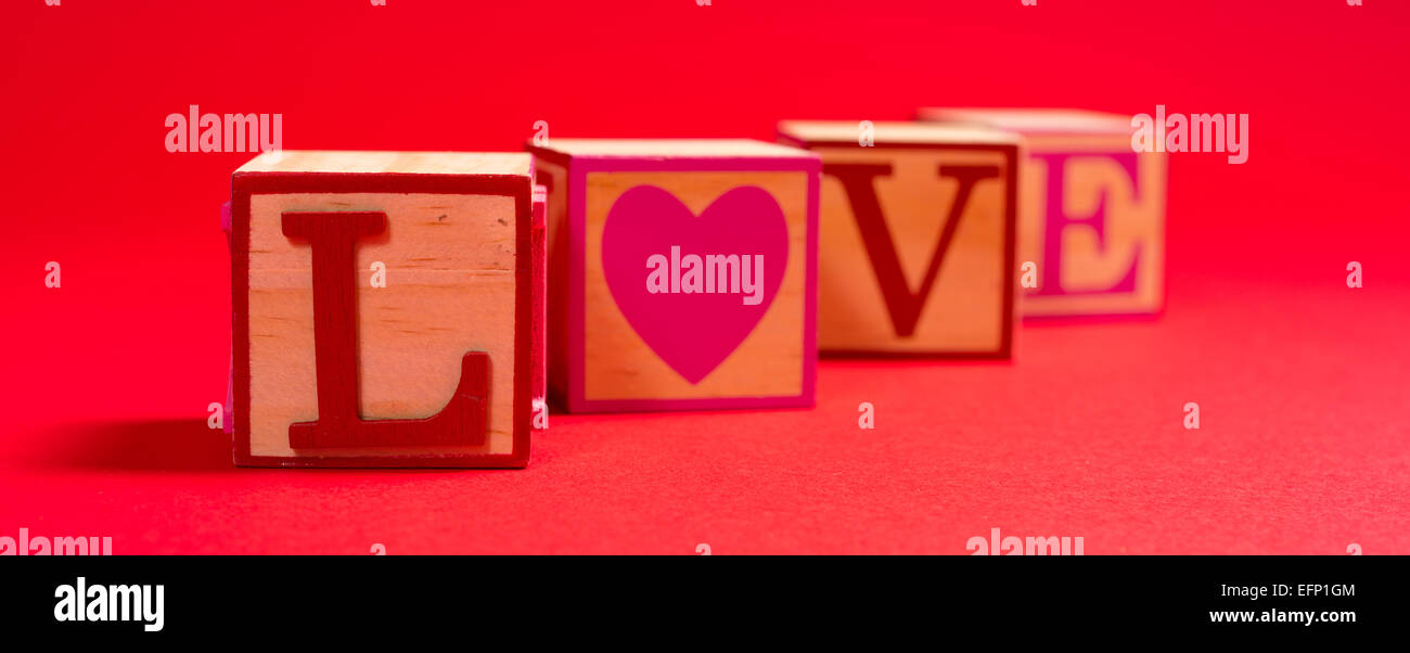 Valentine's day decoration with the word love in wooden alphabet blocks ...