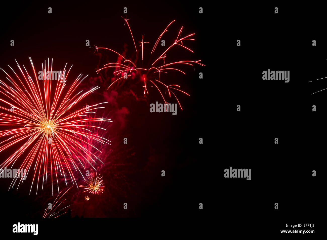 A red fireworks display in the night sky Stock Photo - Alamy