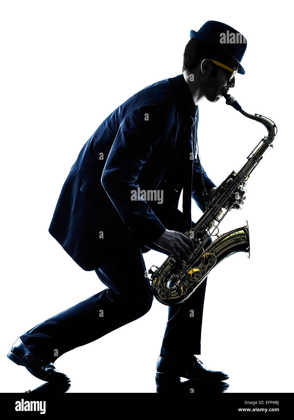 one caucasian man saxophonist playing saxophone player in studio ...