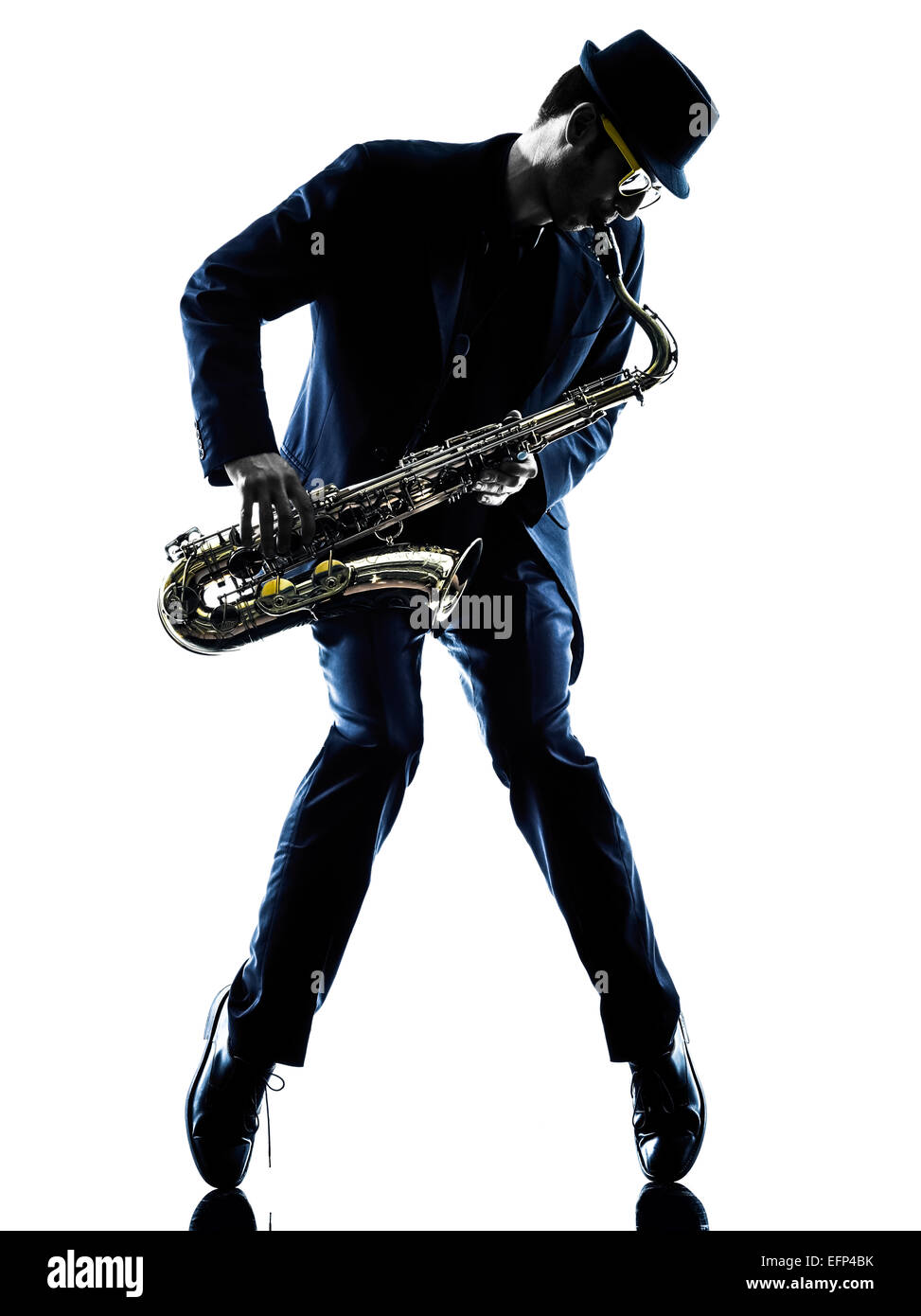 one caucasian man saxophonist playing saxophone player in studio ...