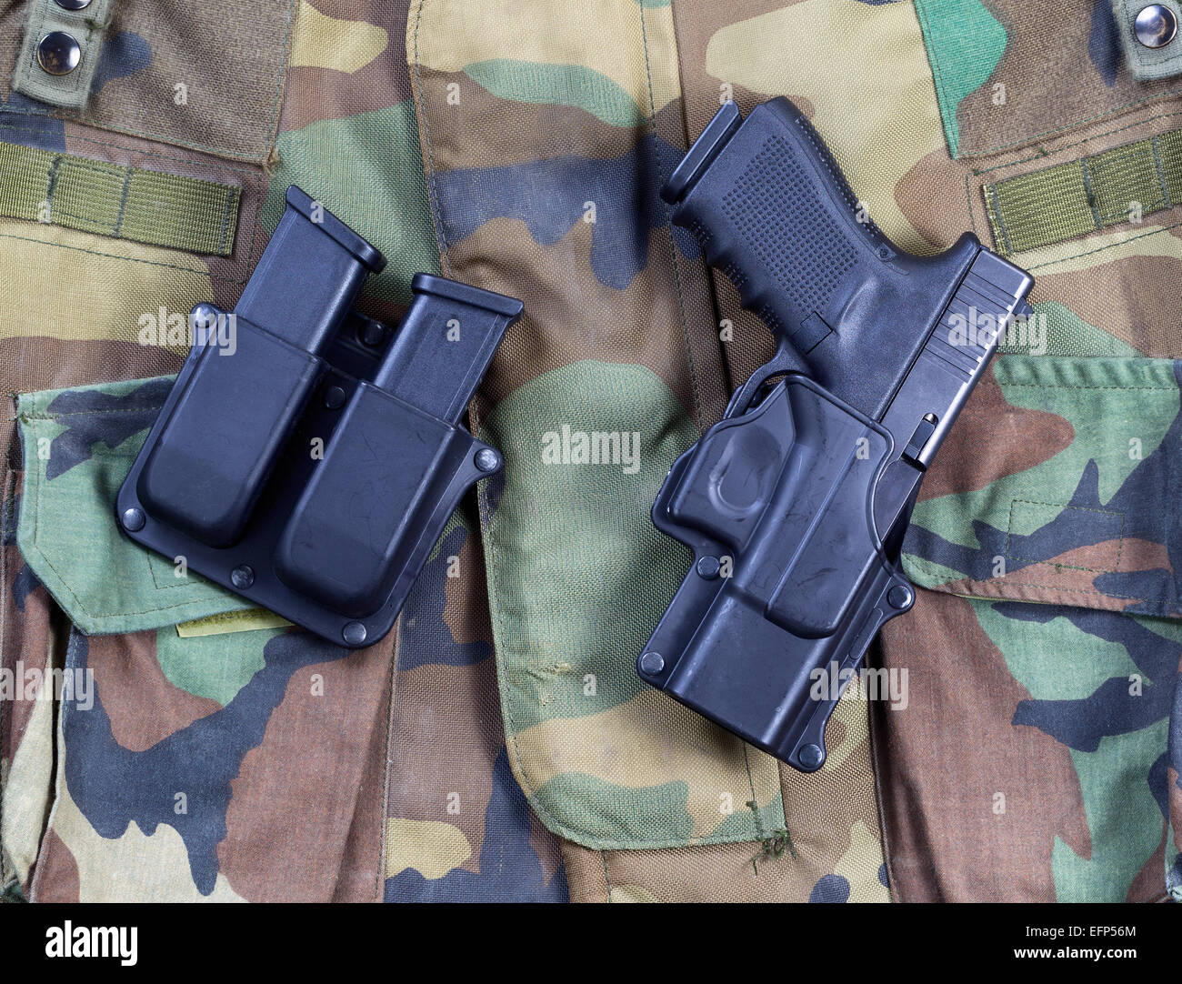 Top view angled shot of United States military uniform with weapon in ...