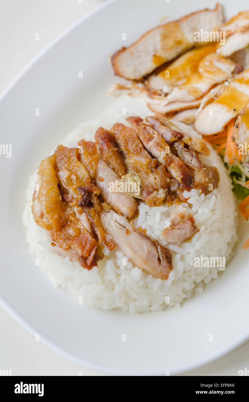 close up fried Chicken over steamed rice on plate Stock Photo - Alamy
