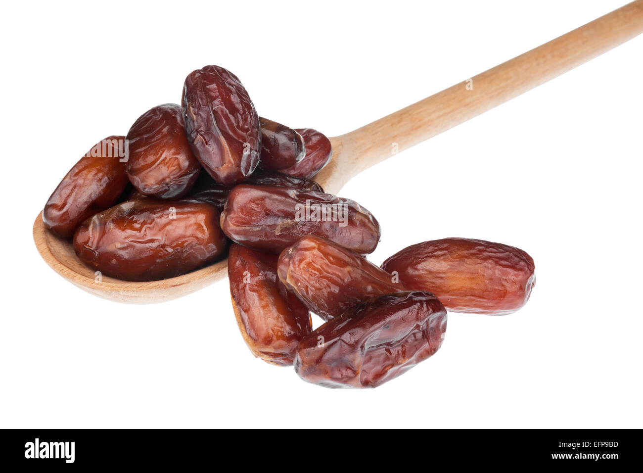 Dried finik in a wooden spoon, isolated on a white background Stock ...