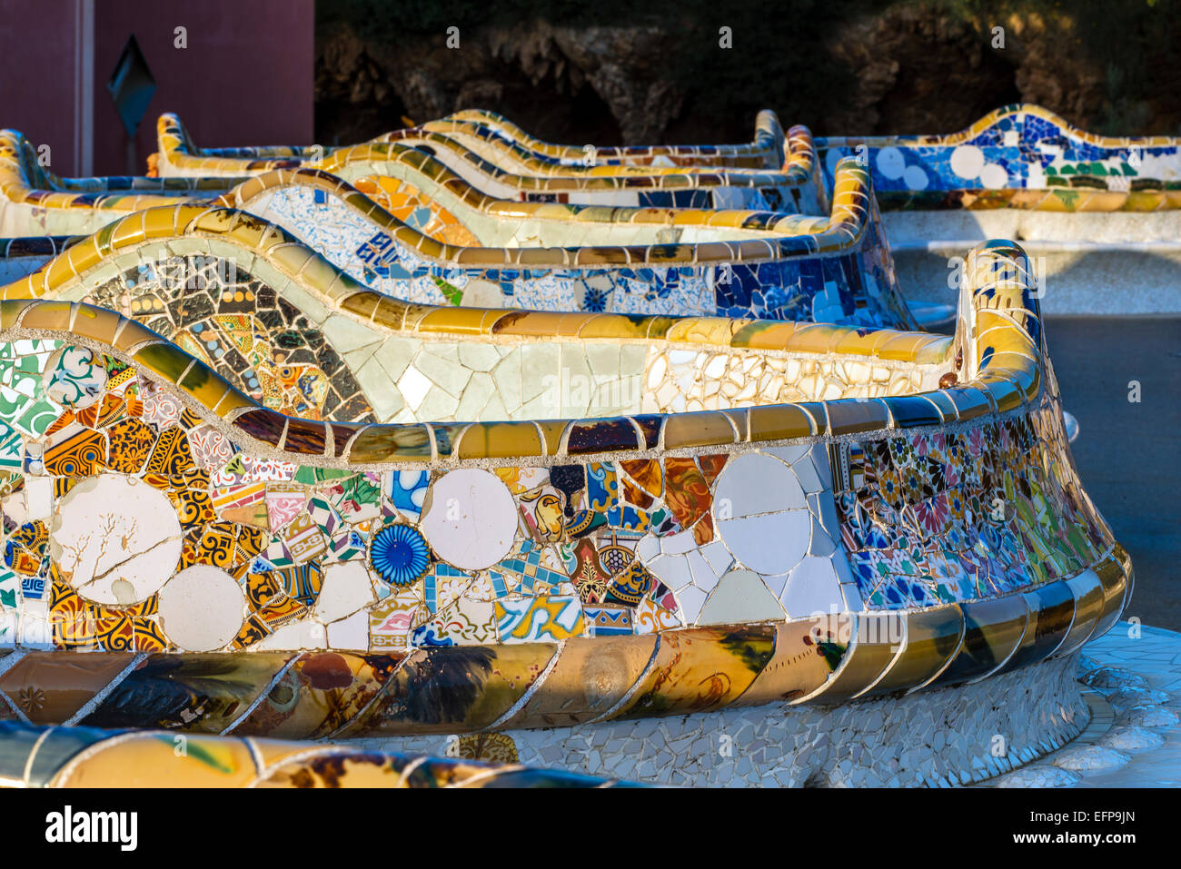 Multicolored mosaic bench at Park Guell or Parc Guell, Barcelona ...