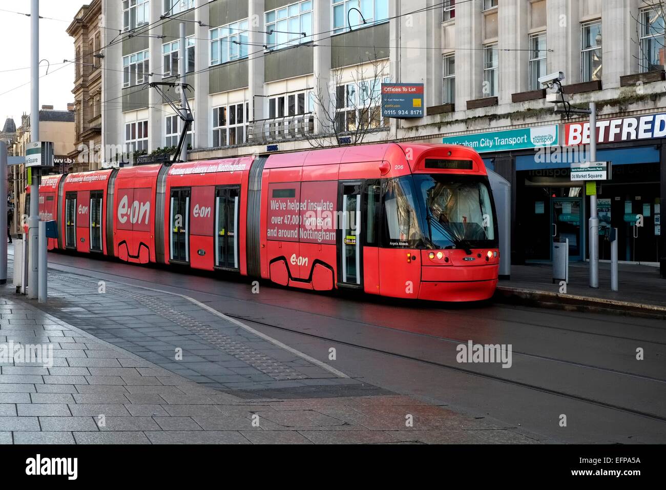 Nottingham express transit tram painted in in EON red livery England UK ...