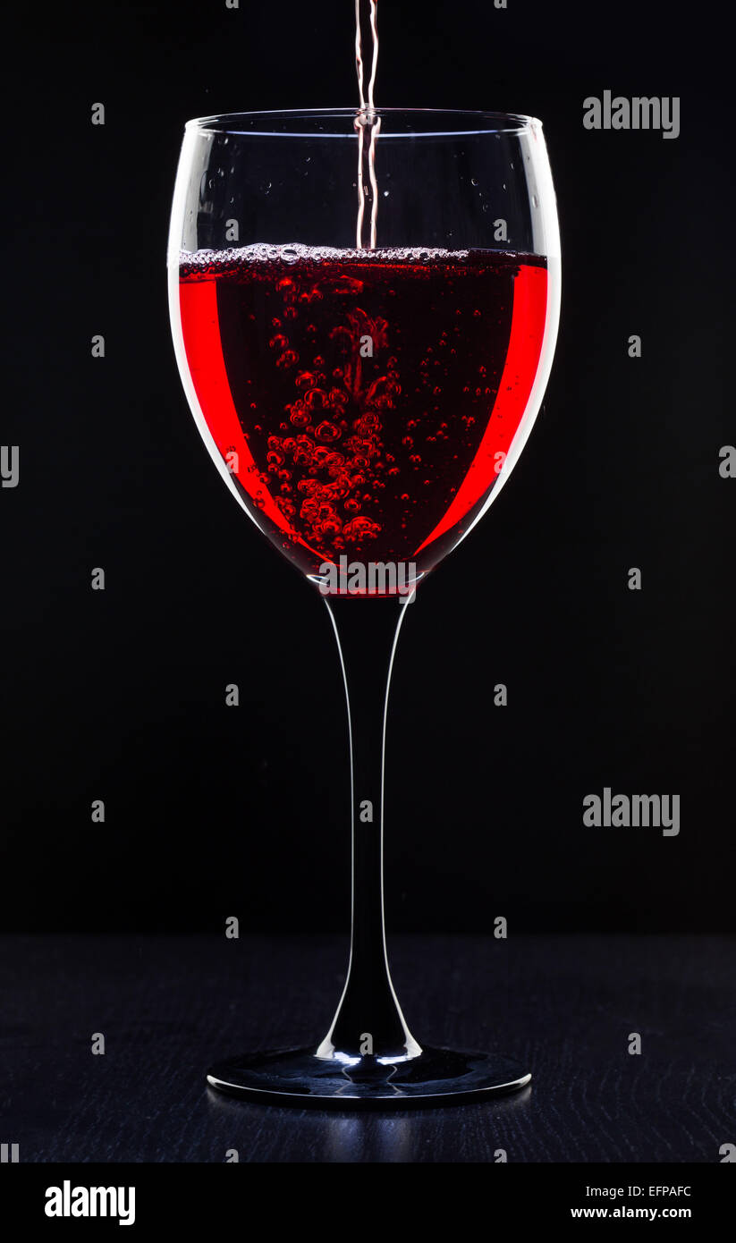 Red wine pouring Stock Photo - Alamy