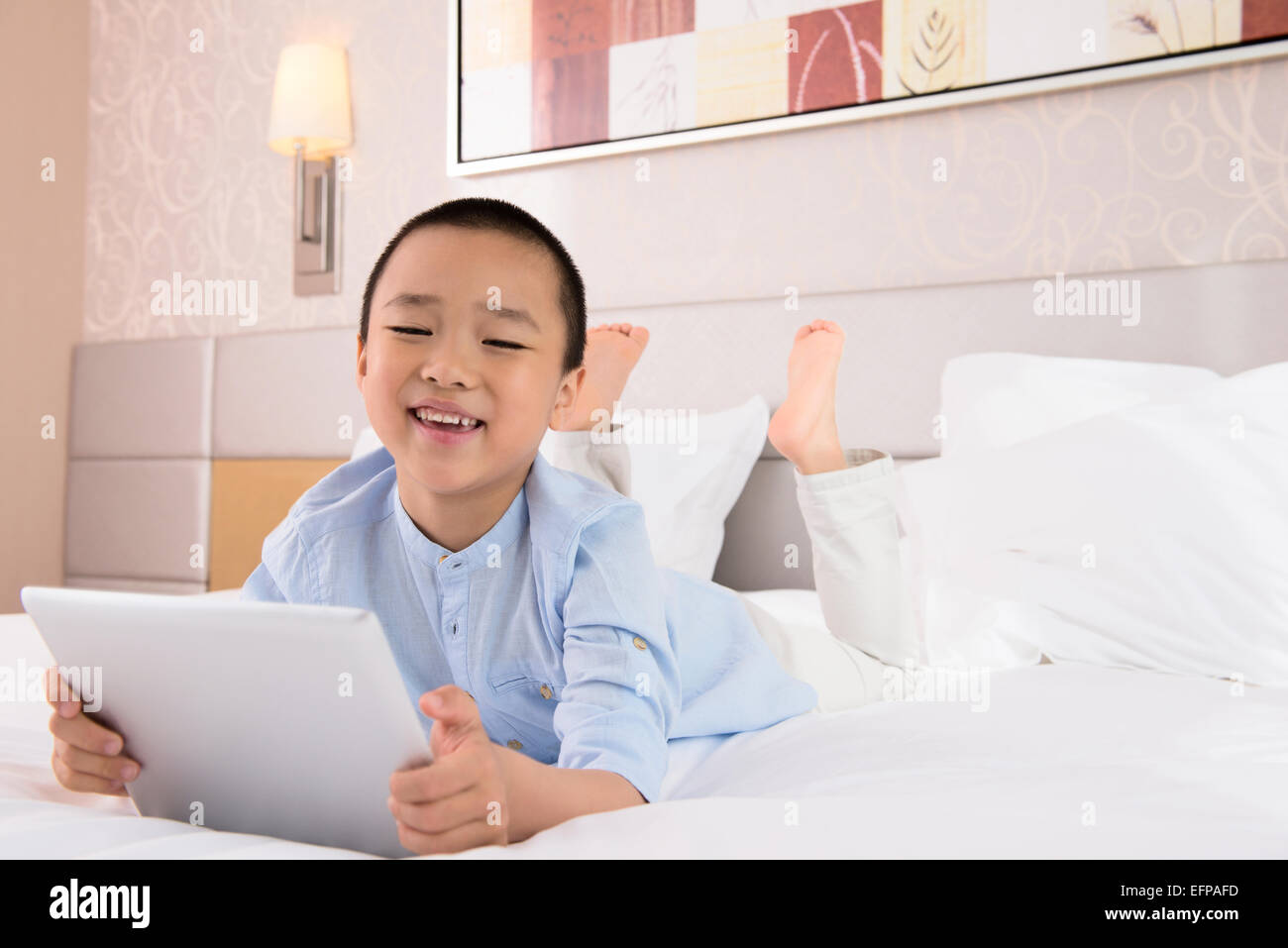 Boy lying in bed bed hi-res stock photography and images - Alamy