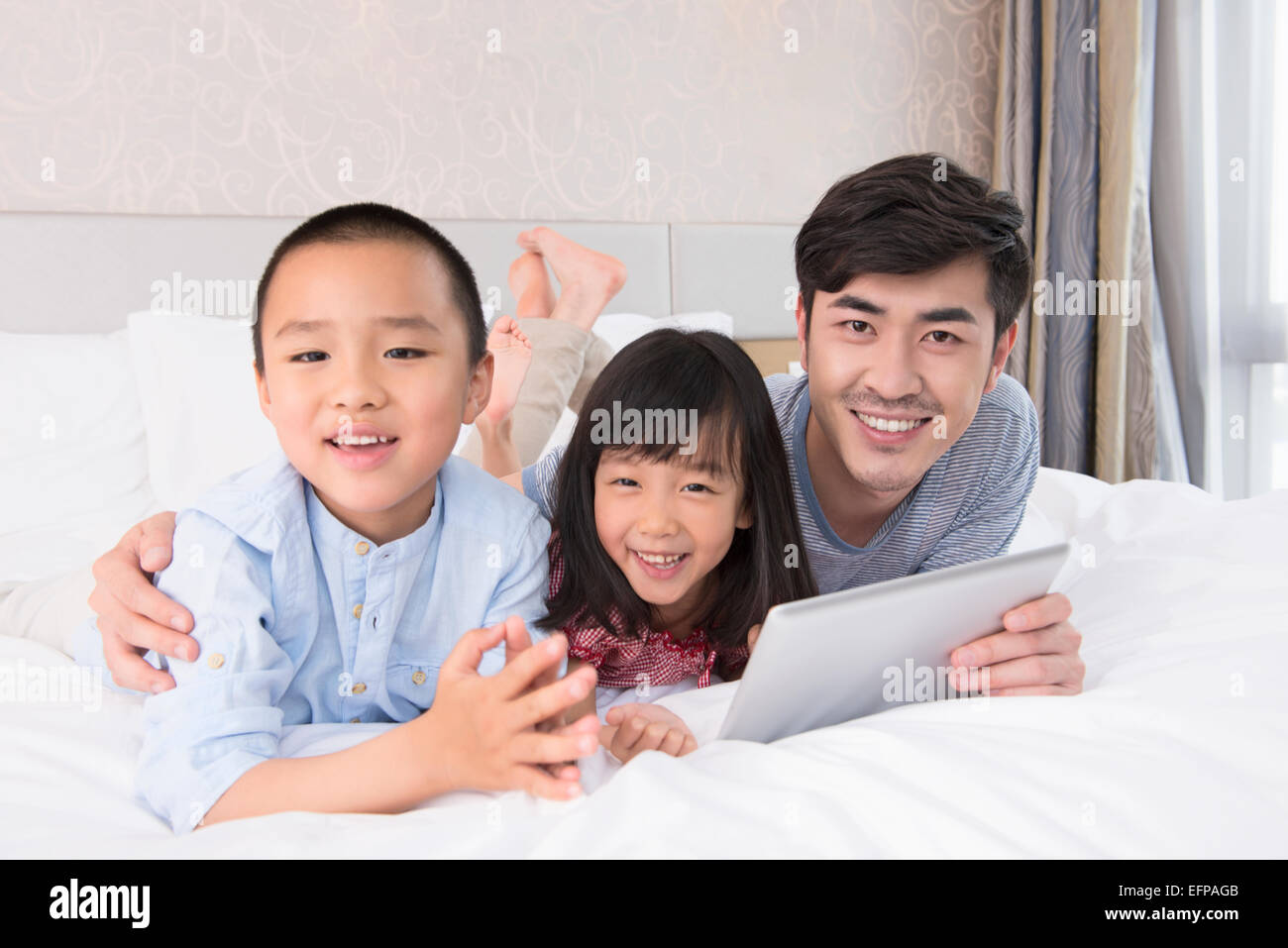 Children use tablet hi-res stock photography and images - Alamy