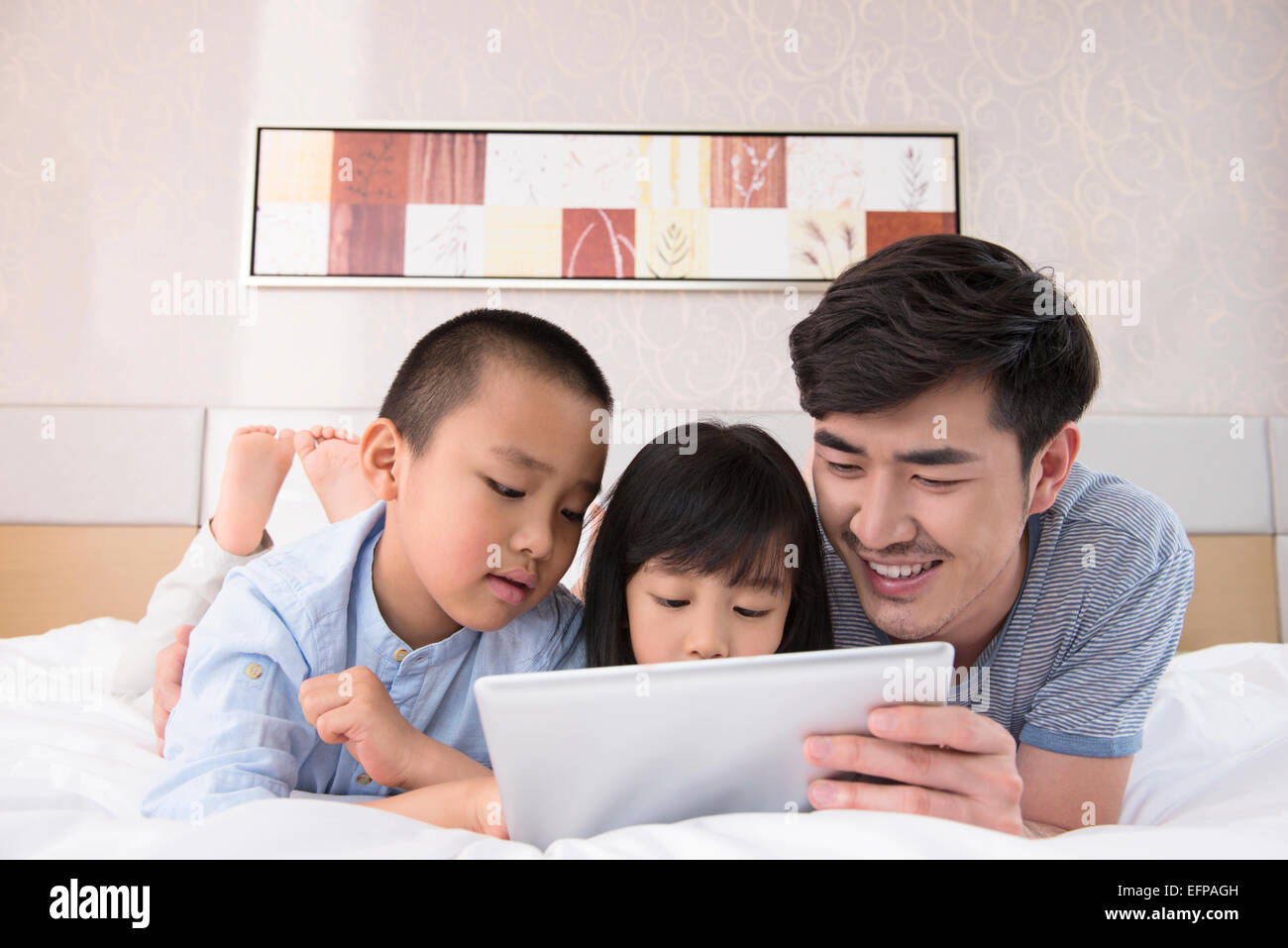 Child Using Ipad In Bed High Resolution Stock Photography and Images ...