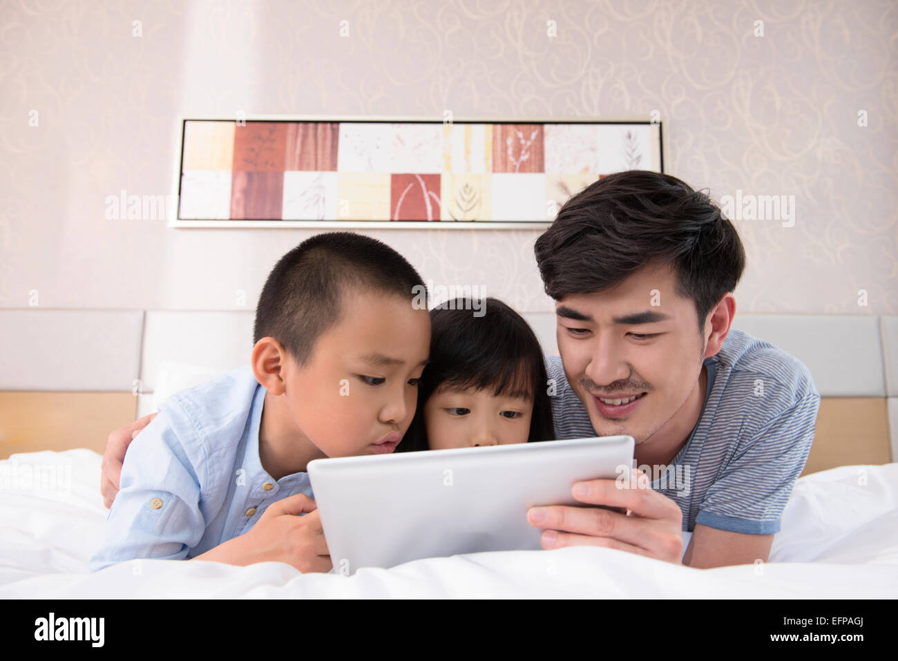 Child Using Ipad In Bed High Resolution Stock Photography and Images ...