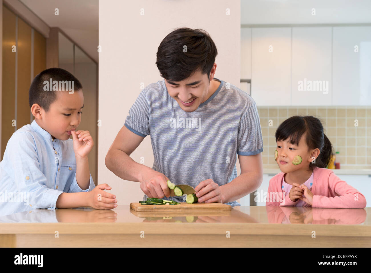 Father cooking with children Stock Photo - Alamy
