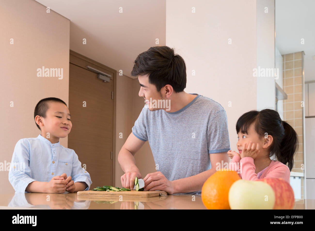 Father cooking with children Stock Photo - Alamy