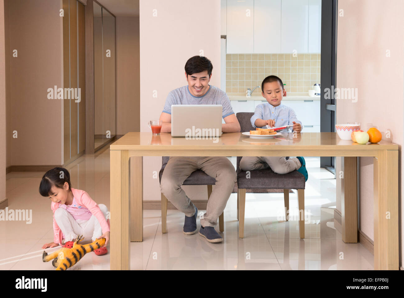 Father working at home with children Stock Photo - Alamy