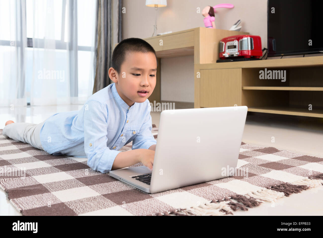 Smiling asian boy using hi-res stock photography and images - Alamy