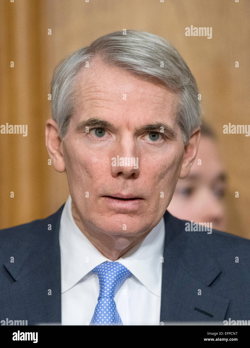 United States Senator Rob Portman (Republican of Ohio) listens as John ...