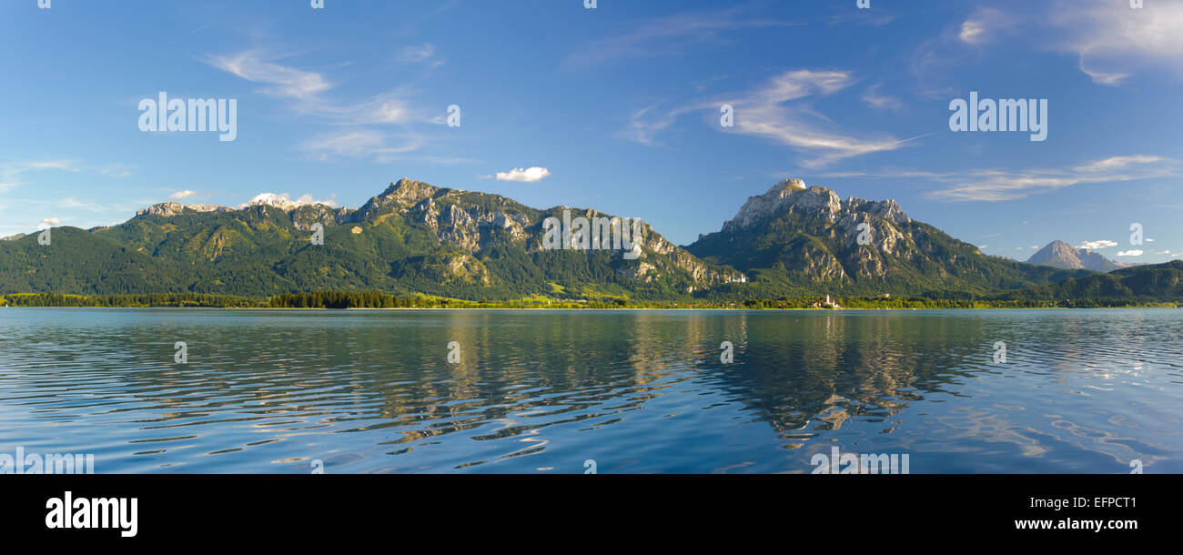 Panorama landscape in Bavaria at alps mountains and lake Forggensee ...