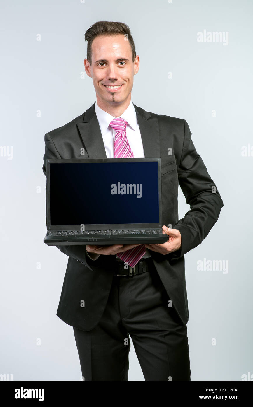 Holding laptop in hand hi-res stock photography and images - Alamy