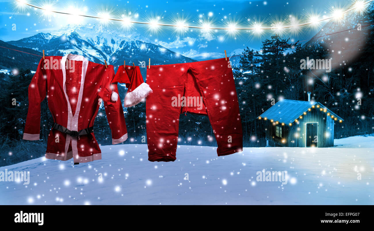 Santa clothing hanging on a clothes line Stock Photo - Alamy