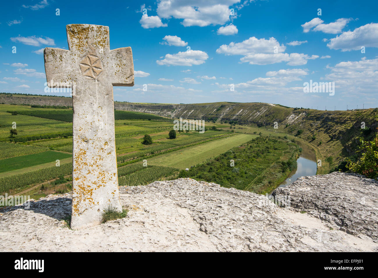 Old Christian cross above the historical temple complex of old Orhei ...