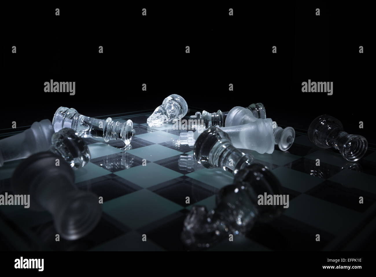 Glass chess board - overturned dummies Stock Photo - Alamy