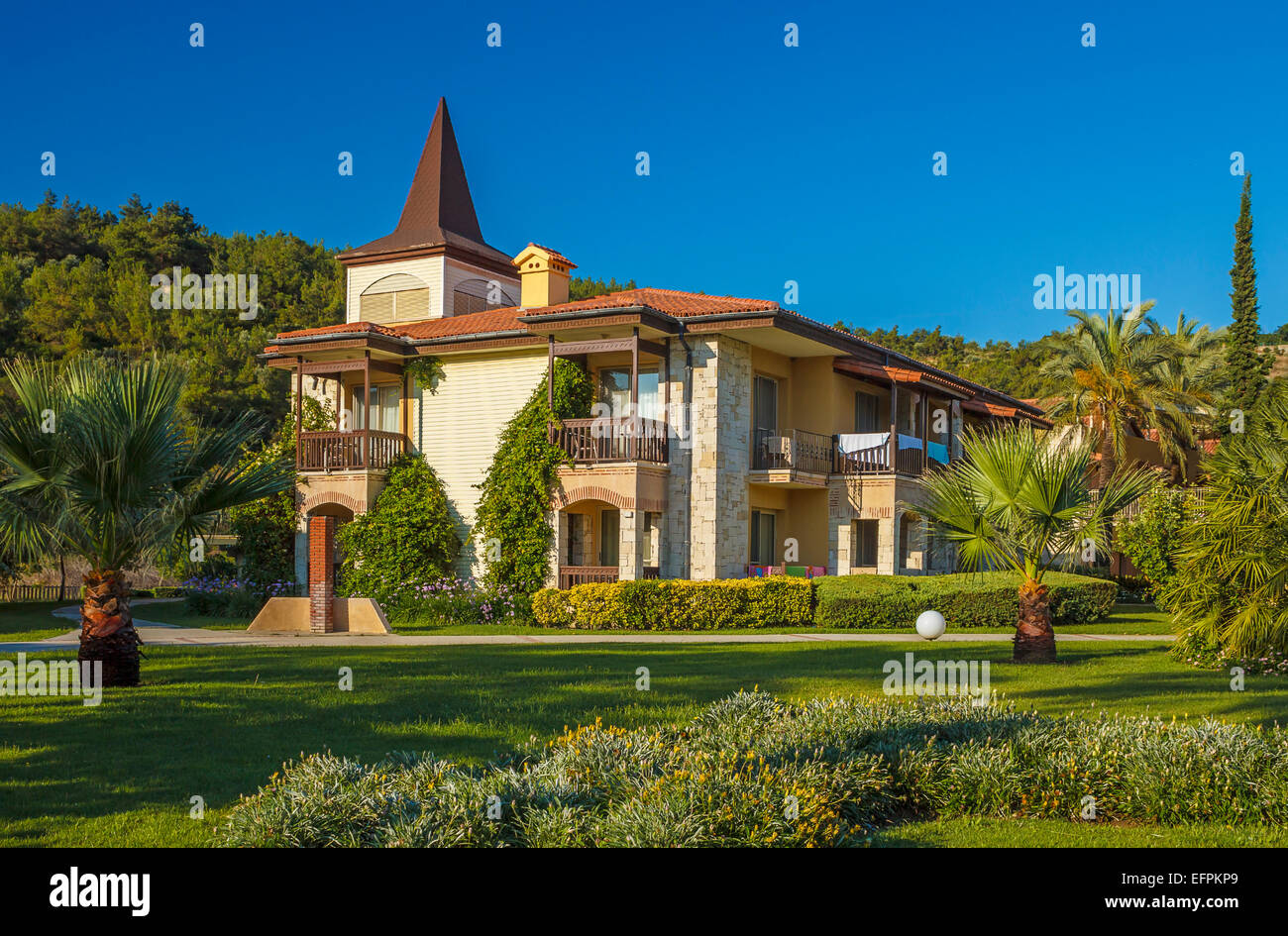 Country house and beautiful green lawn Stock Photo - Alamy